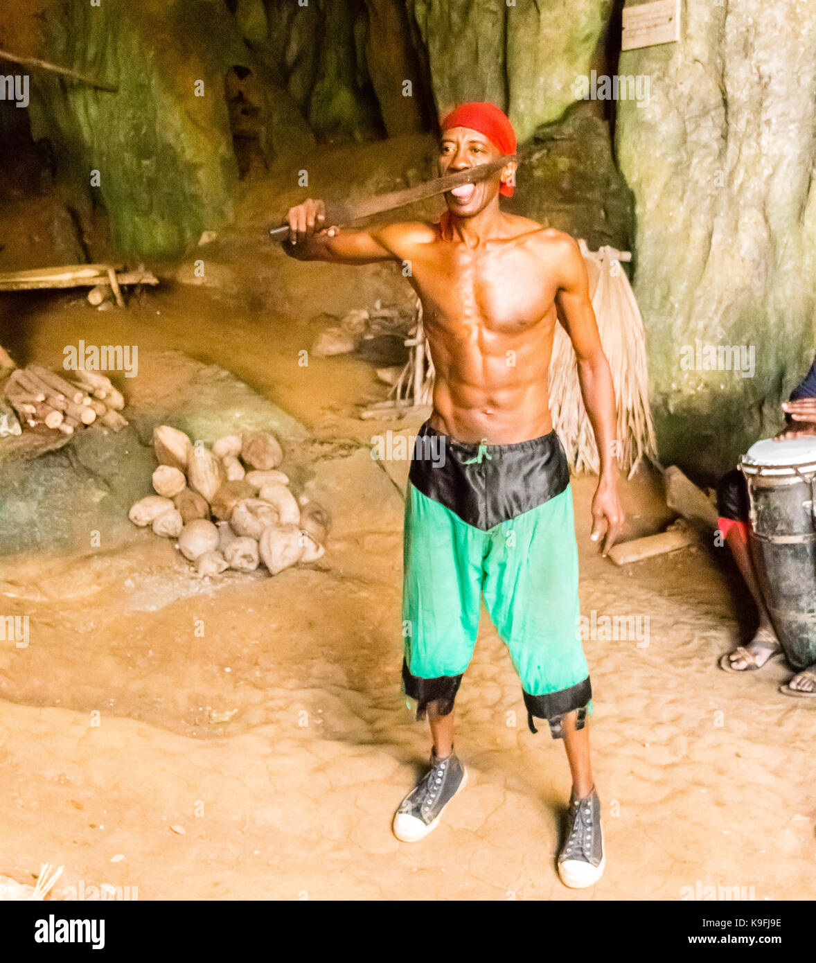 Fire eater performer at the Cueva de San Miguel, San Miguel Cave, San ...