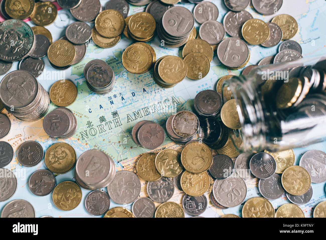 Map world globe coins hi-res stock photography and images - Alamy