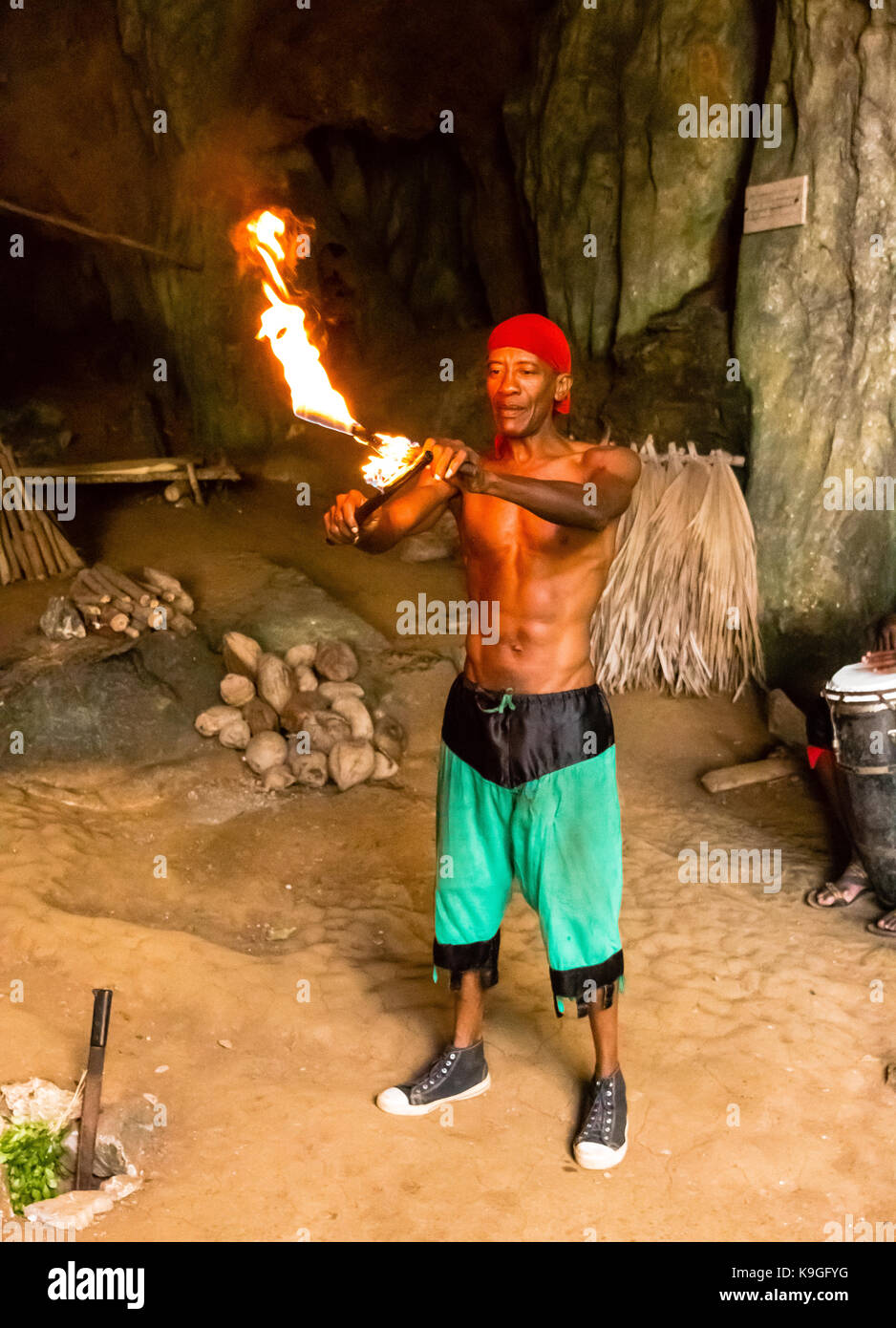 Fire eater performer at the Cueva de San Miguel, San Miguel Cave, San ...