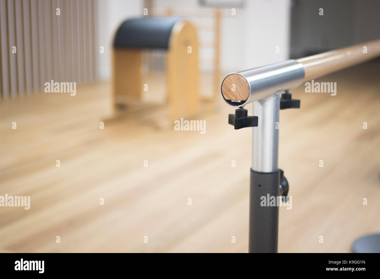 Pilates and ballet dance training stretching bar in gym training ...