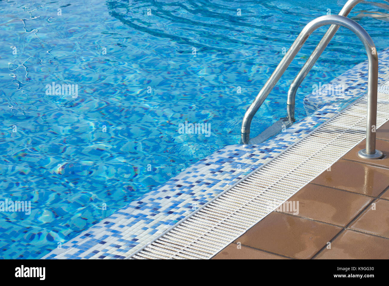 Blue swimming pool on hot sunny day on summer vacation Stock Photo - Alamy