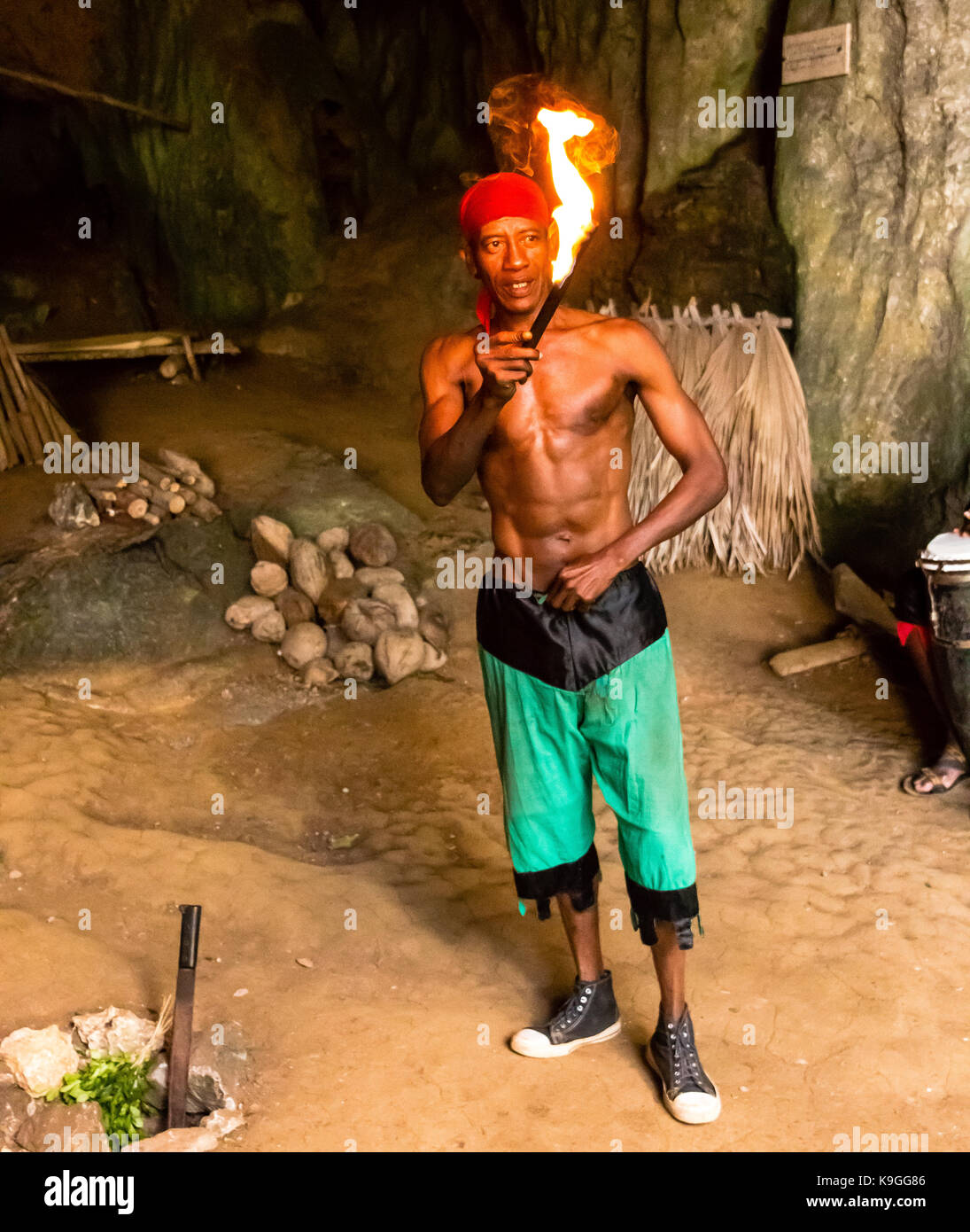 Fire eater performer at the Cueva de San Miguel, San Miguel Cave, San ...