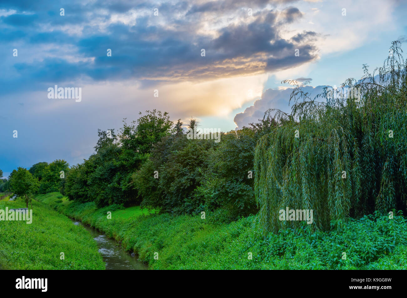 picture of a rural landscape at dusk with cloudy sky Stock Photo - Alamy