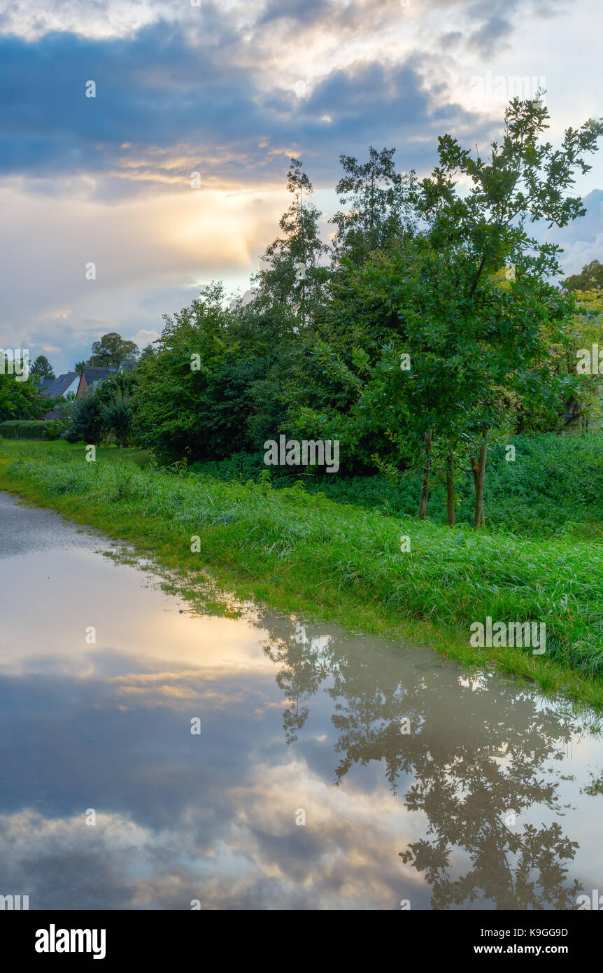 picture of a rural landscape at dusk with cloudy sky Stock Photo - Alamy