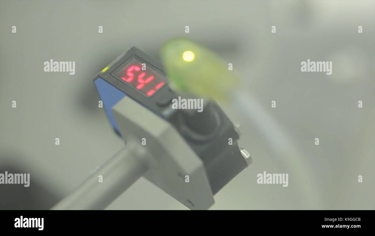 Technician use thermal imaging camera to check temperature in factory ...