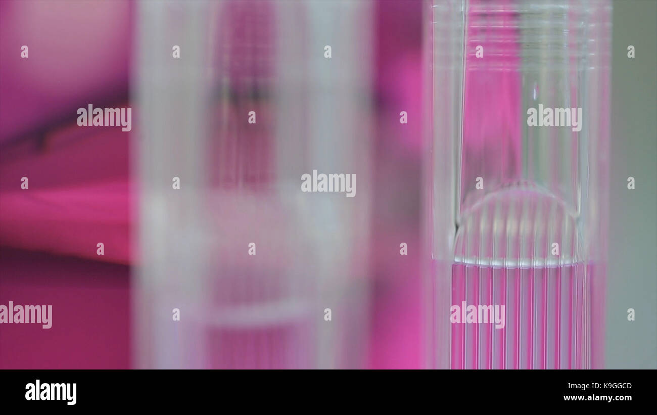 Test tubes with colorful liquids. liquid is mixed in a special ...