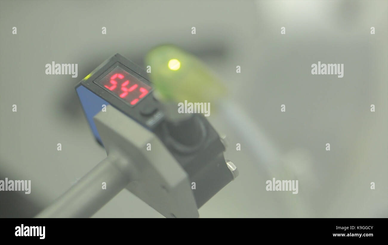 Technician use thermal imaging camera to check temperature in factory ...
