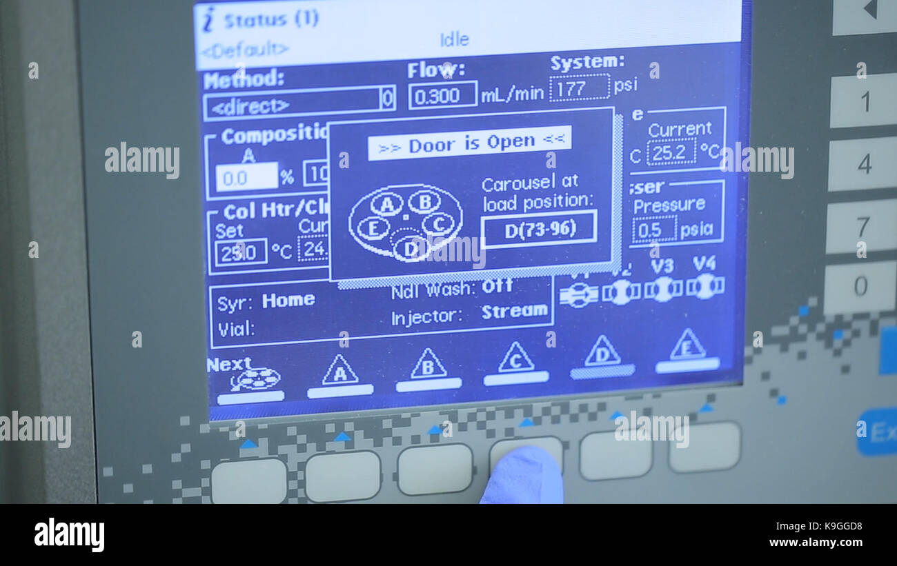 Medical staff working with automatic machine. Analysis blood at ...