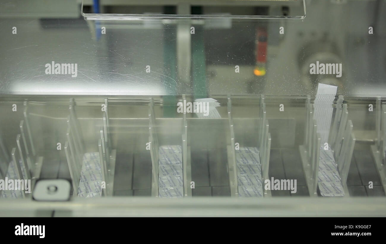 Interior of a pharmaceutical industry equipment for packing pills boxes ...