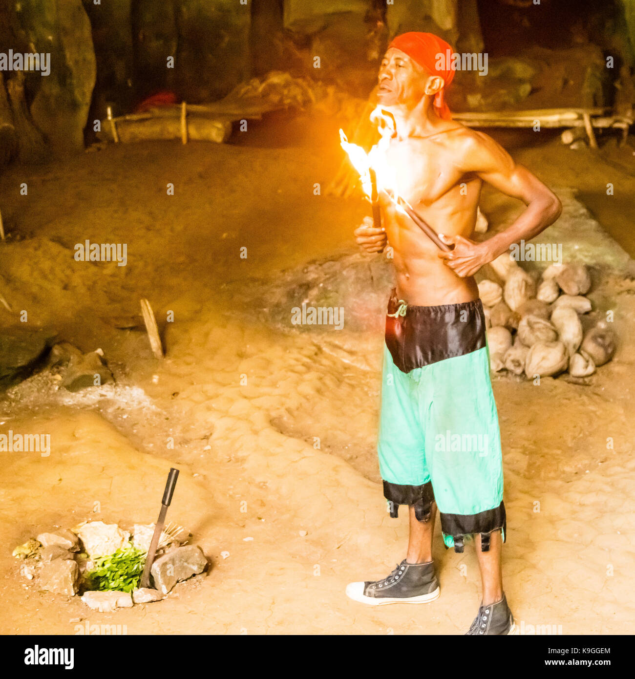 Fire eater performer at the Cueva de San Miguel, San Miguel Cave, San ...