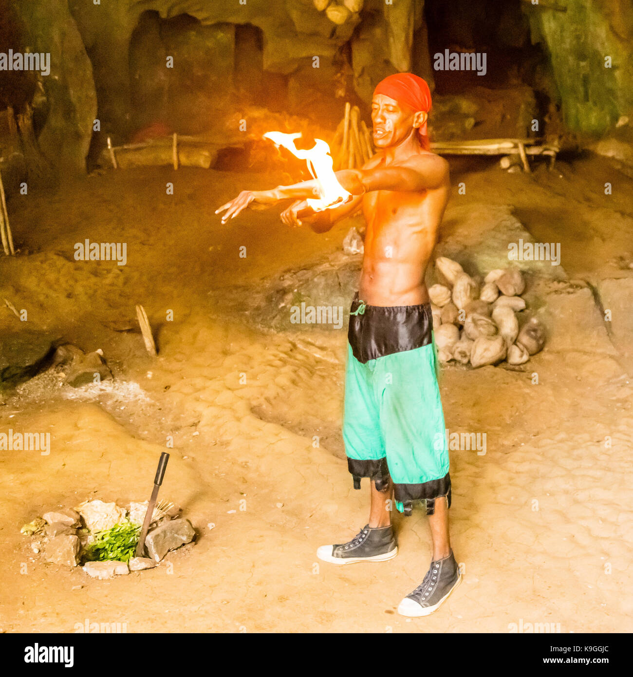 Fire eater performer at the Cueva de San Miguel, San Miguel Cave, San ...
