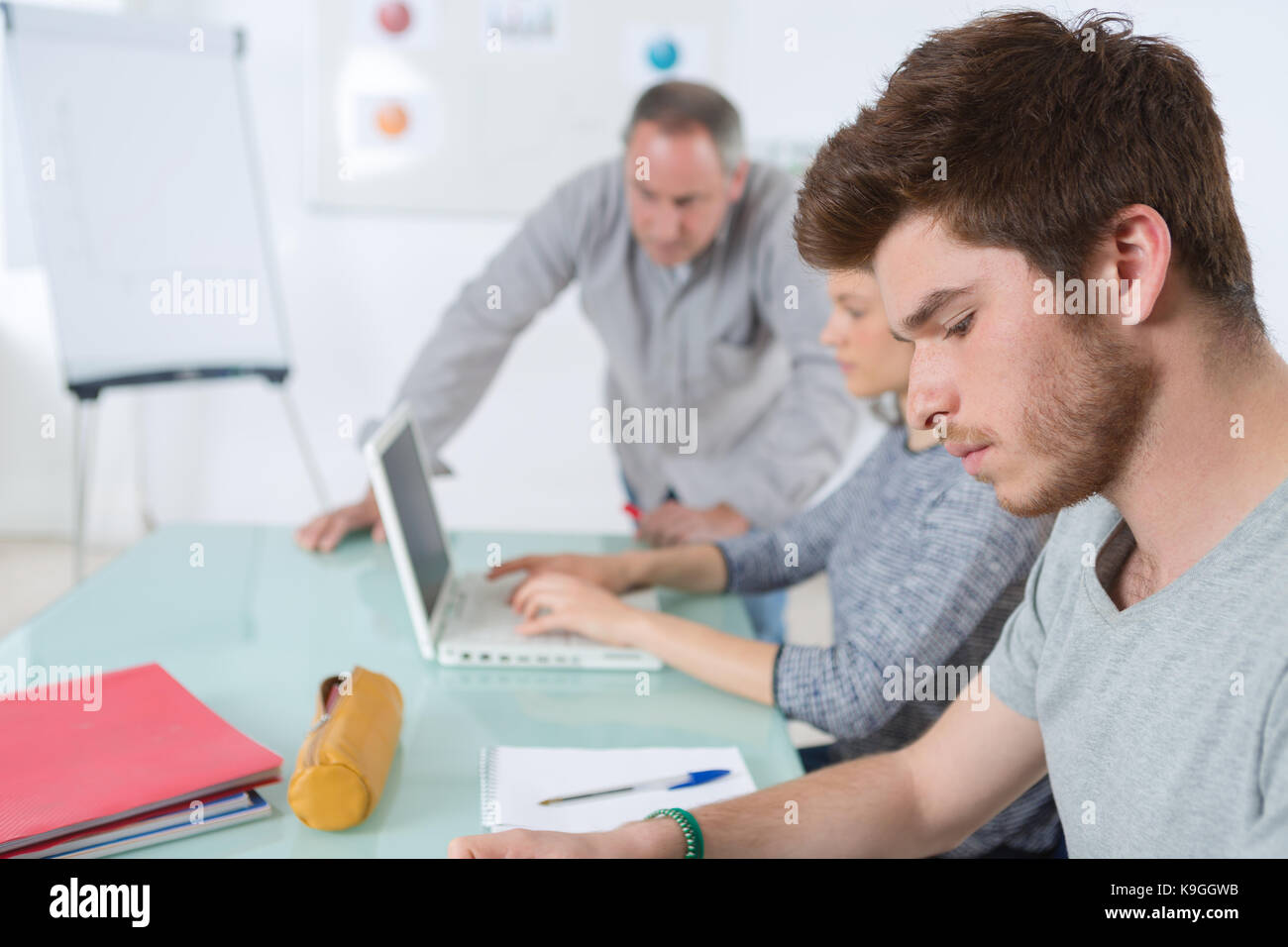 students in classroom at desk with laptop computer Stock Photo - Alamy