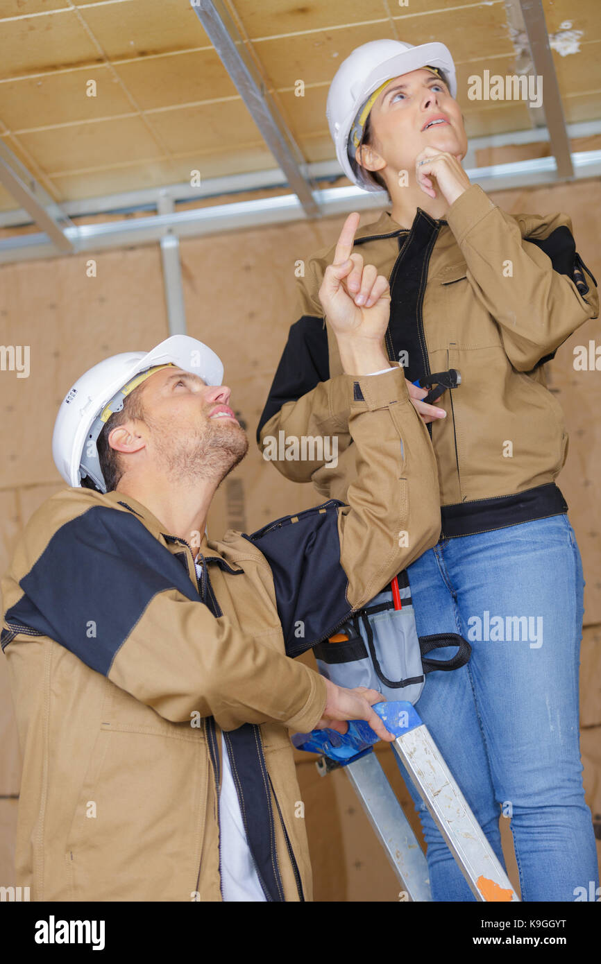 male and female construction workers in wooden cabin at site Stock Photo - Alamy
