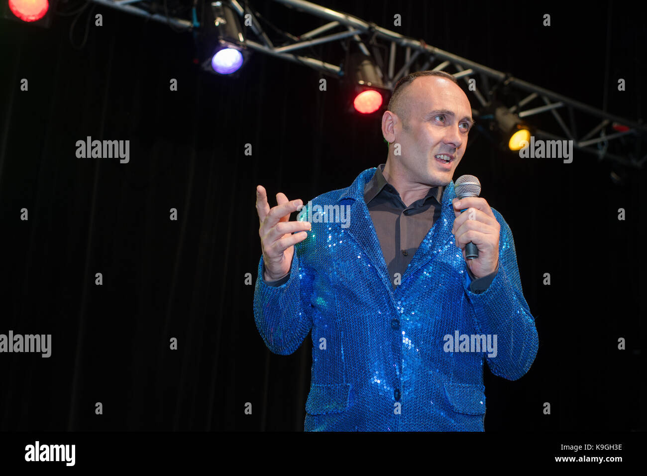 handsome man singing on stage during concert Stock Photo - Alamy