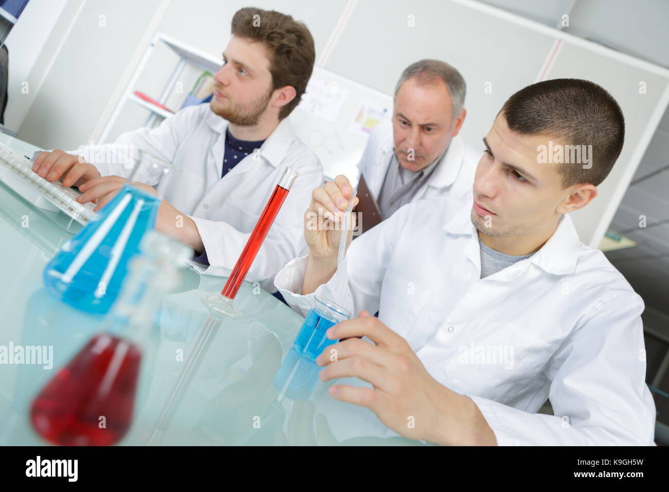 school students with teacher in chemistry class Stock Photo - Alamy