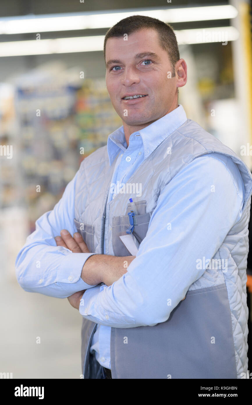 handsome hardware store salesman Stock Photo - Alamy