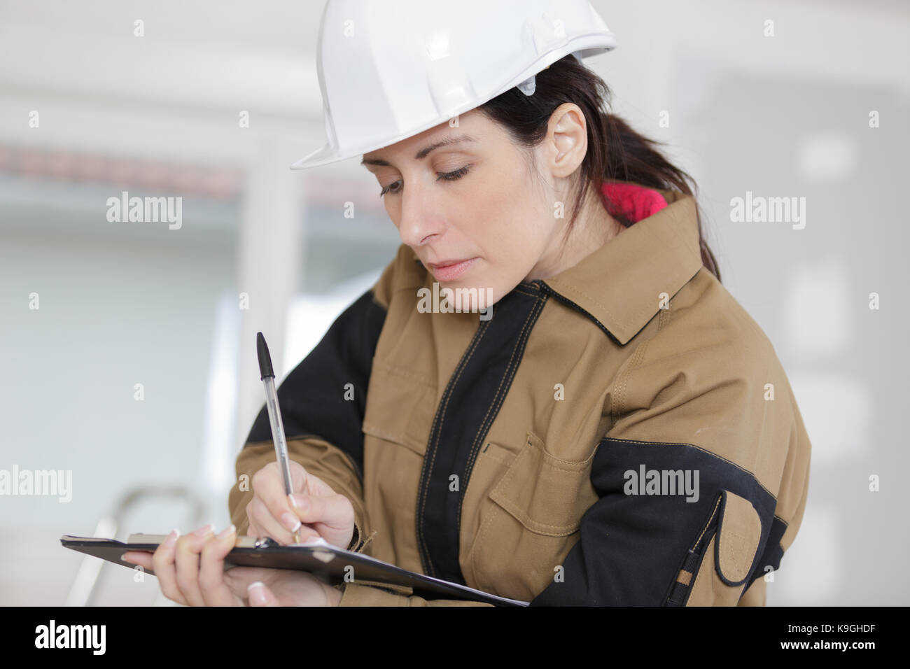 woman worker writing her report Stock Photo - Alamy