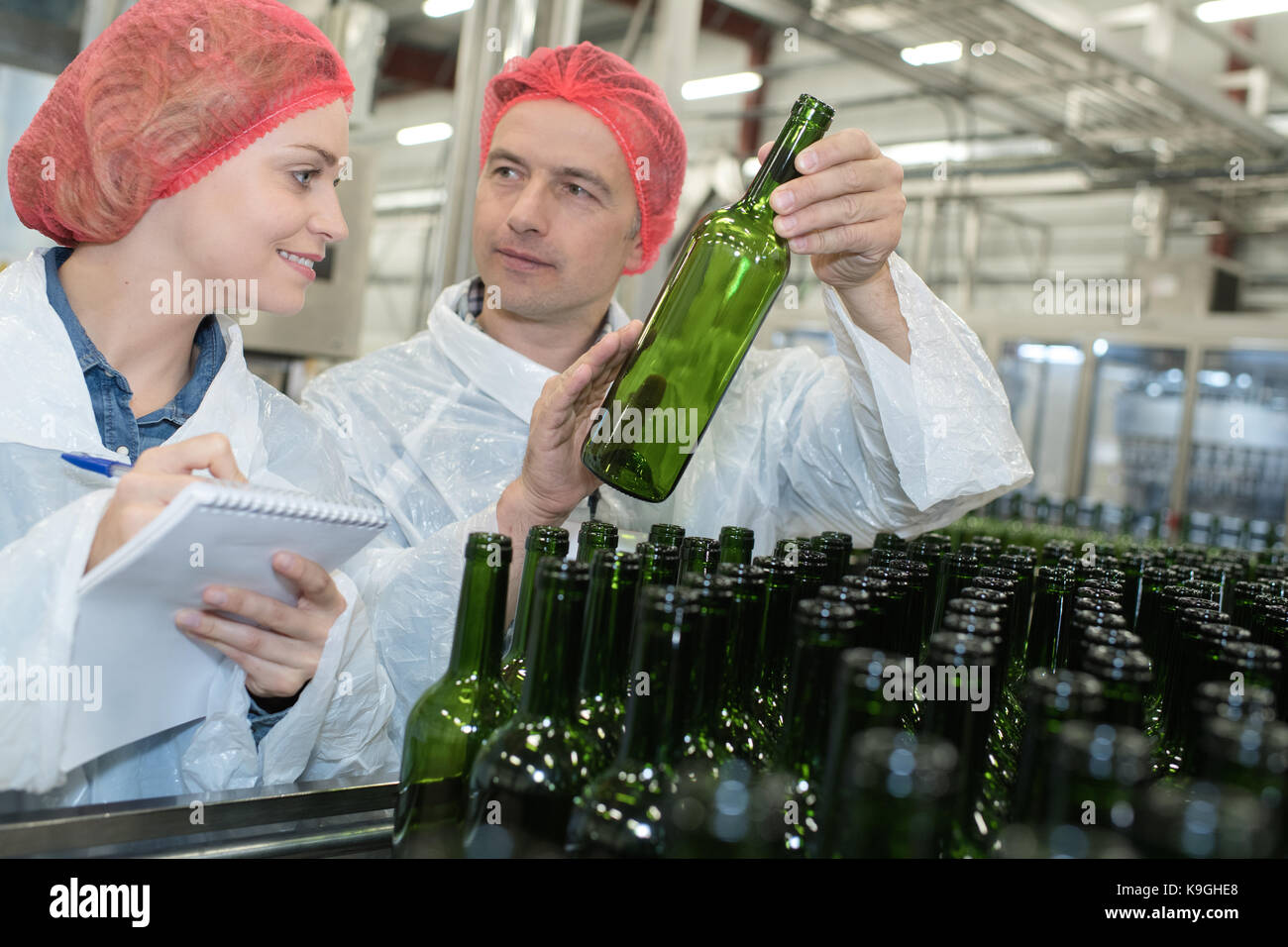 packers working on the bottling line at the manufacture Stock Photo - Alamy
