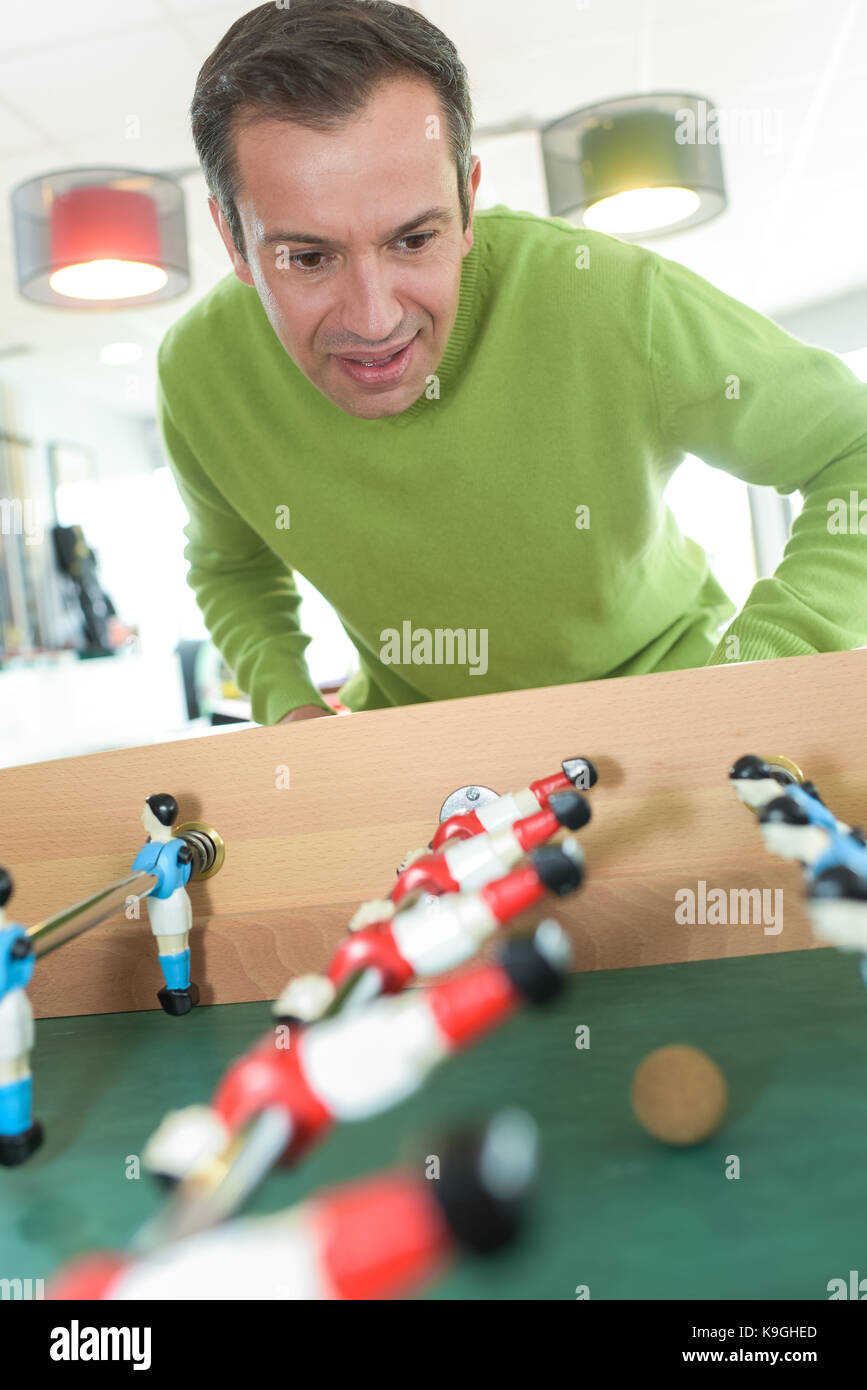 Playing foosball hi-res stock photography and images - Alamy