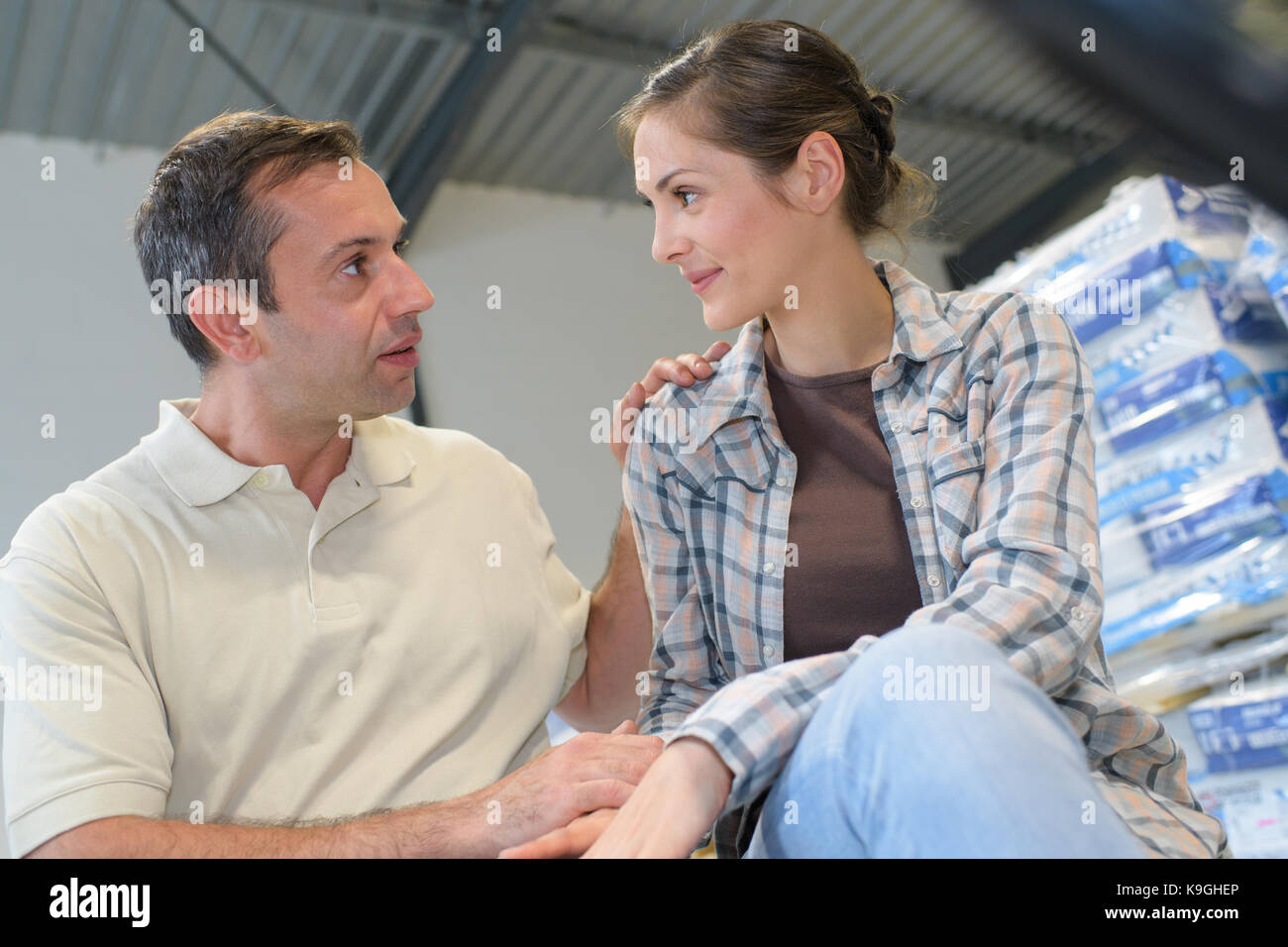 man comforting business partner at work Stock Photo - Alamy