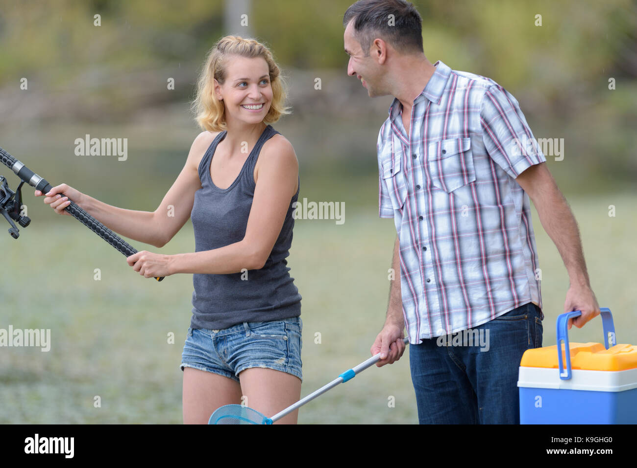 young couple is enjoying fishing together Stock Photo - Alamy