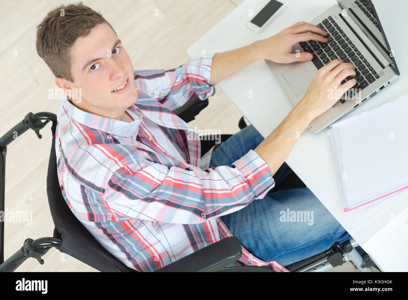 portrait of smart disabled businessman using laptop Stock Photo - Alamy