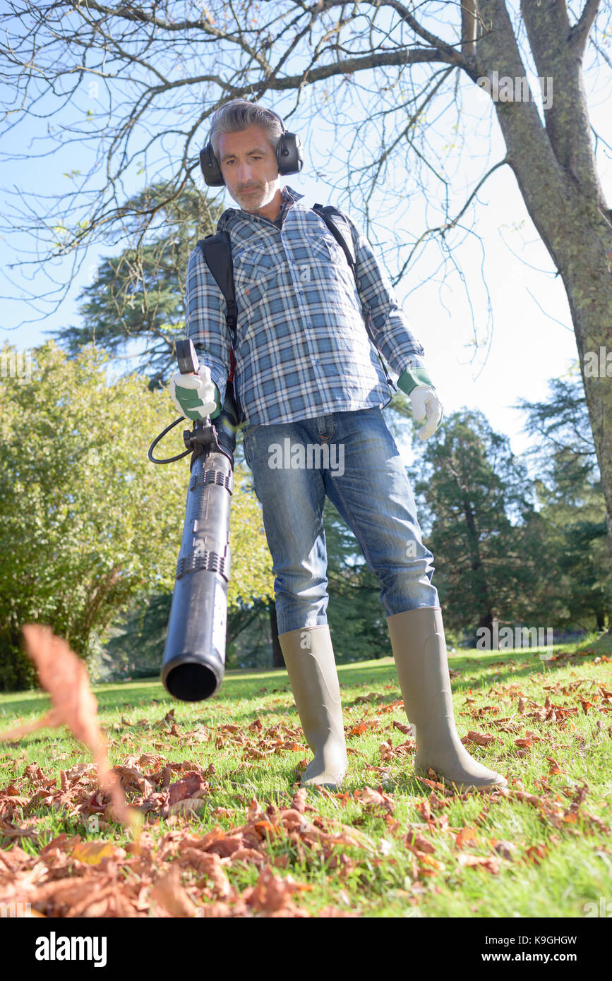 Man using leaf blower Stock Photo - Alamy