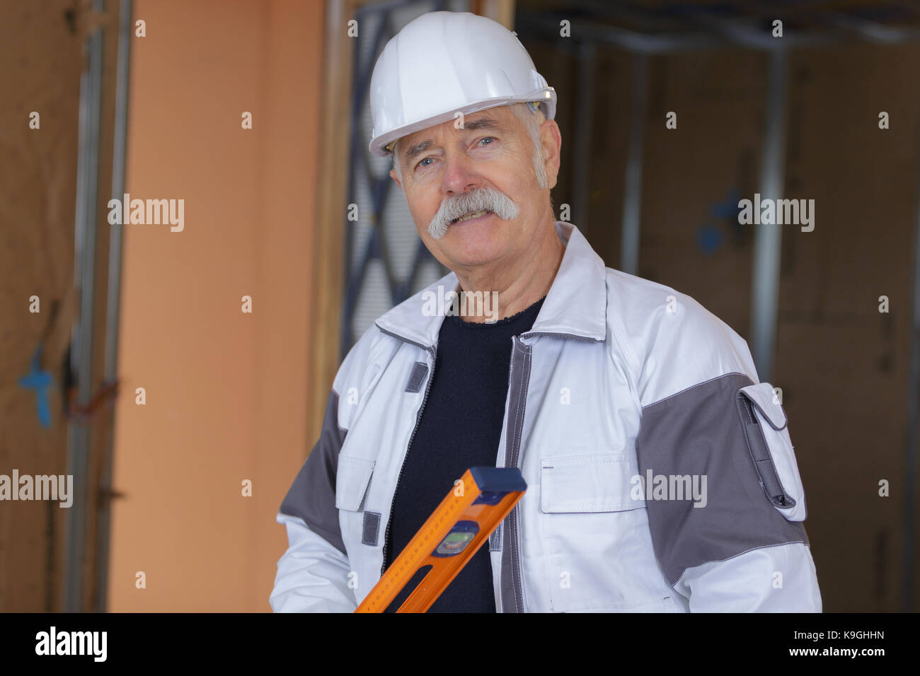 portrait of construction worker on building site Stock Photo - Alamy