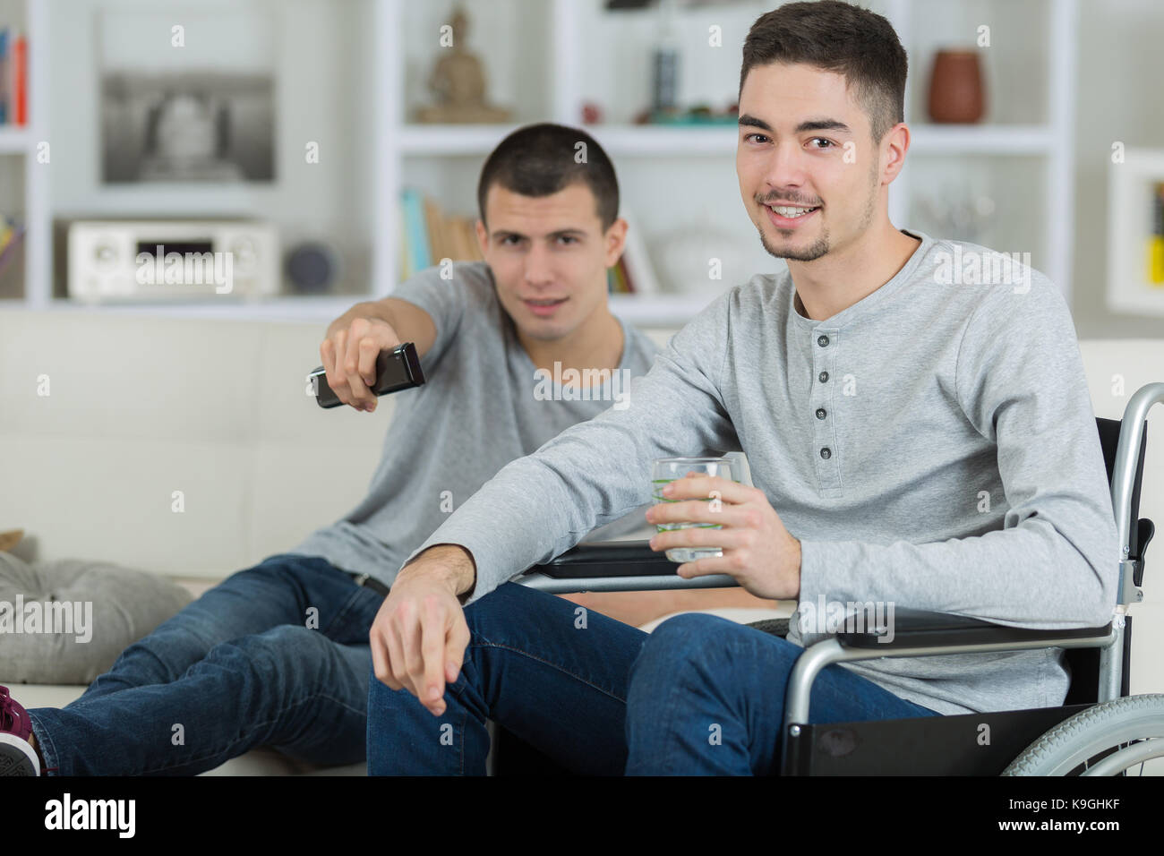 helping a friend in a wheelchair Stock Photo - Alamy