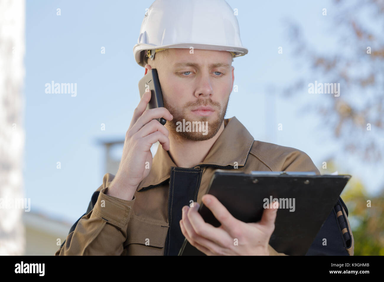 construction agent relaying the information Stock Photo - Alamy