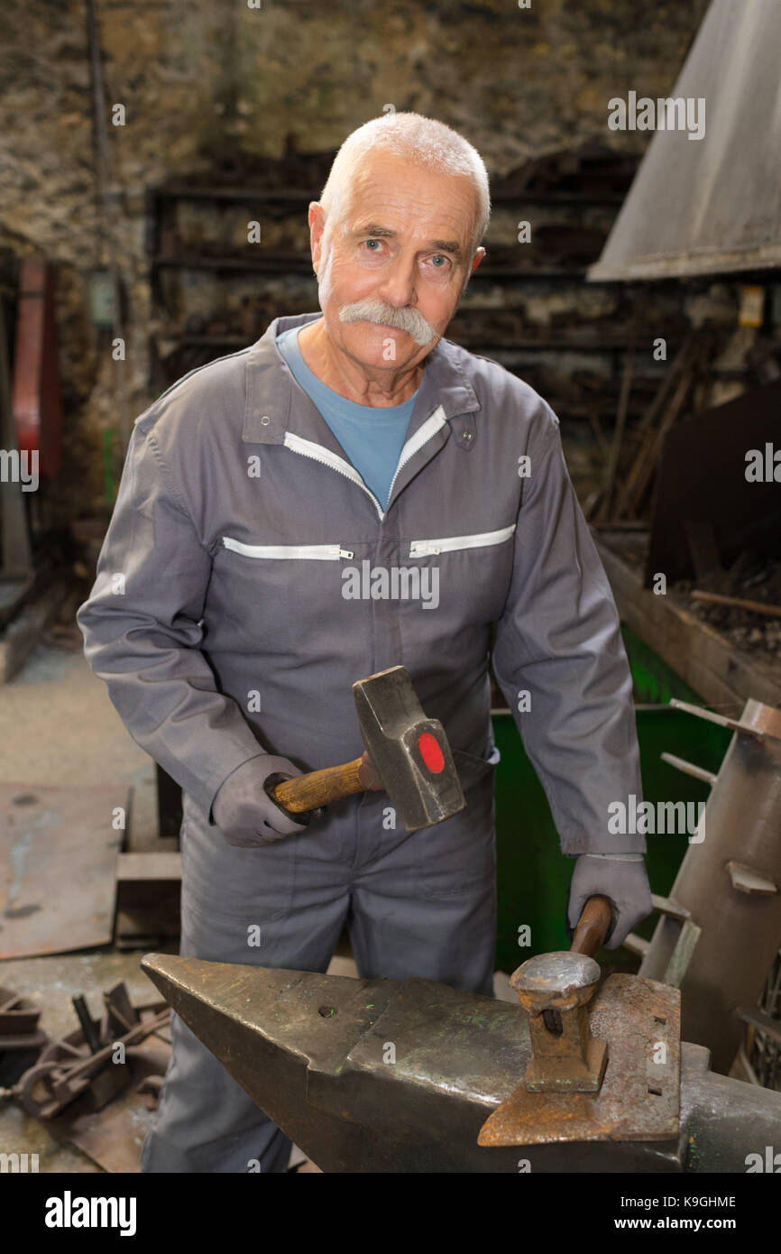blacksmith forging metal Stock Photo - Alamy