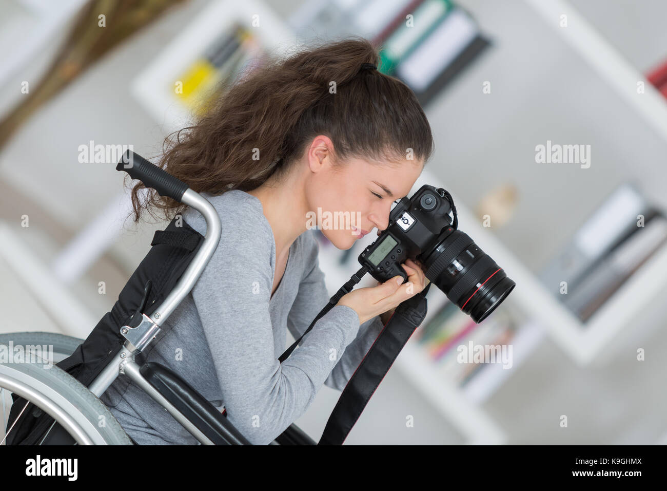young disabled woman using a camera Stock Photo - Alamy