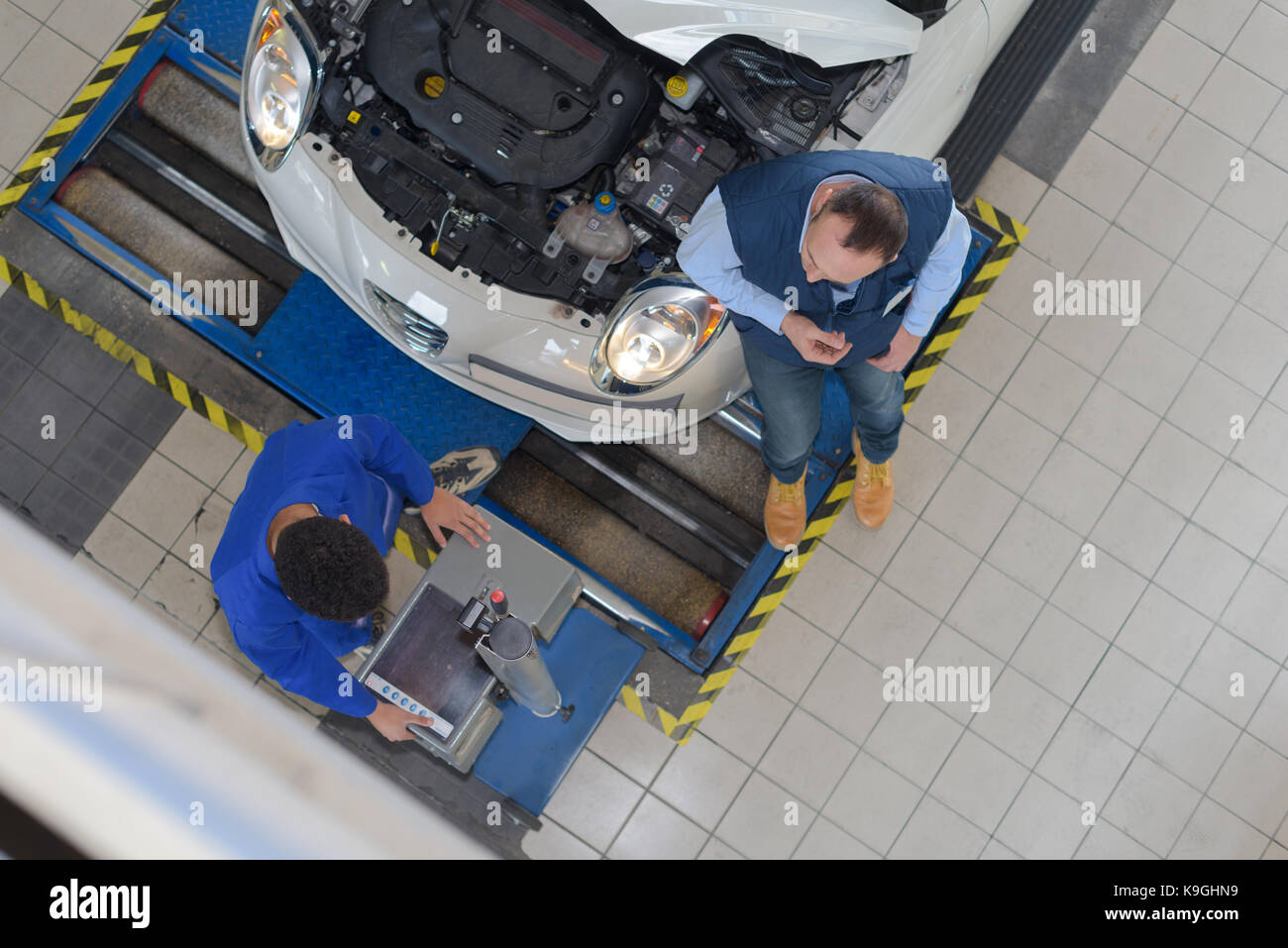 mechanic repairing a car Stock Photo - Alamy