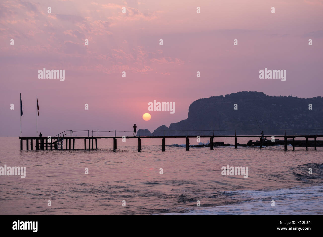 Horizontal seascape with the pier, sea and castle rock of Alanya at ...