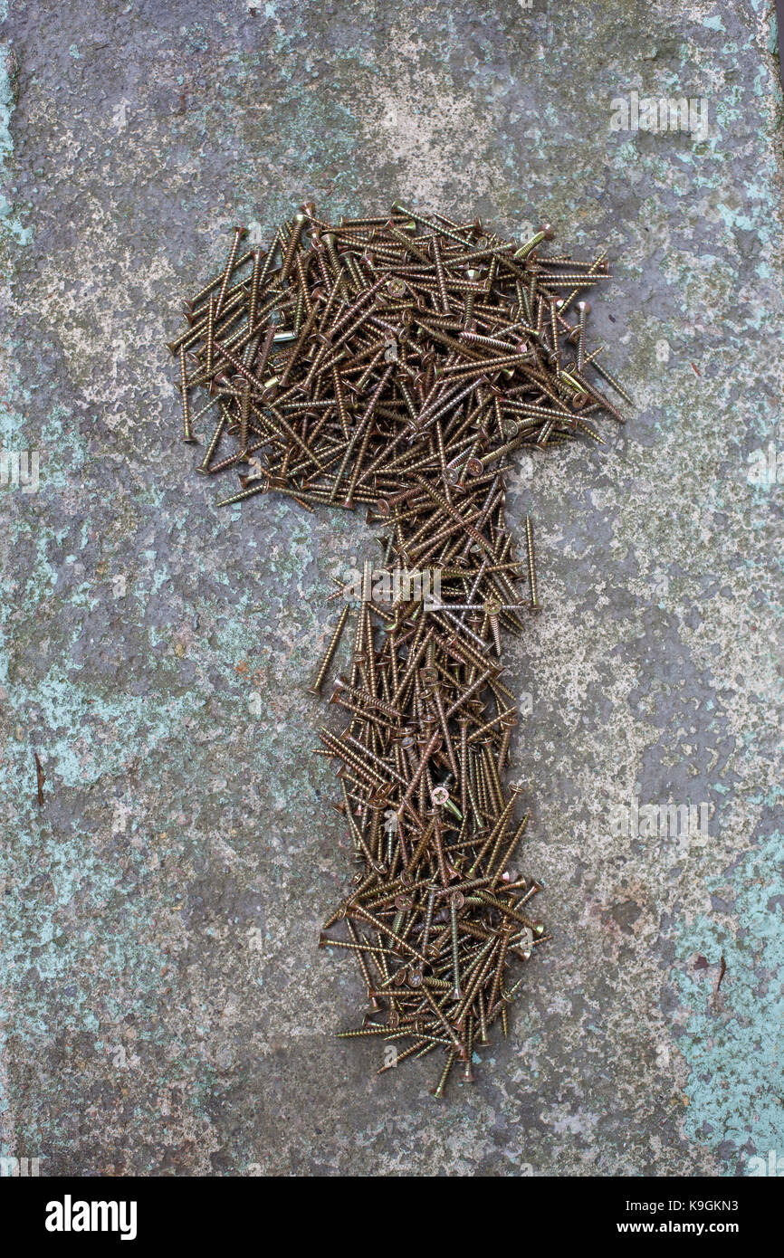 Industrial background texture of gold screws on the concrete background ...