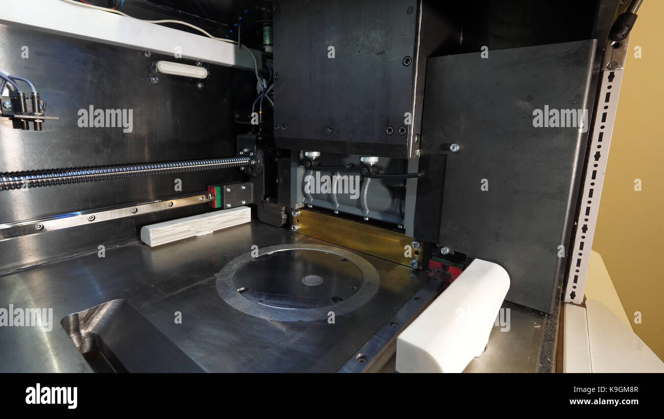 Modern 3D printer printing figure close-up macro. Automatic three ...