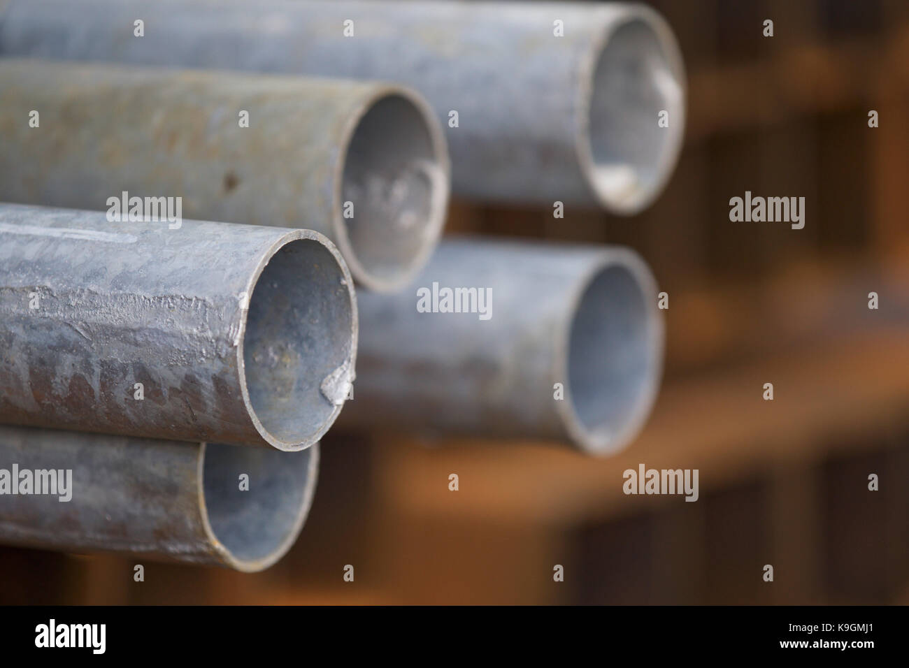 Metal profile pipe of round section in packs at the warehouse of metal ...