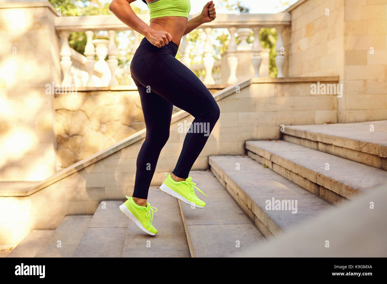 Young woman running down stairs hi-res stock photography and images - Alamy