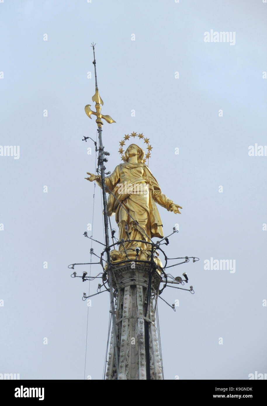 Madonnina statue of Duomo cathedral in Milan, Italy Stock Photo - Alamy