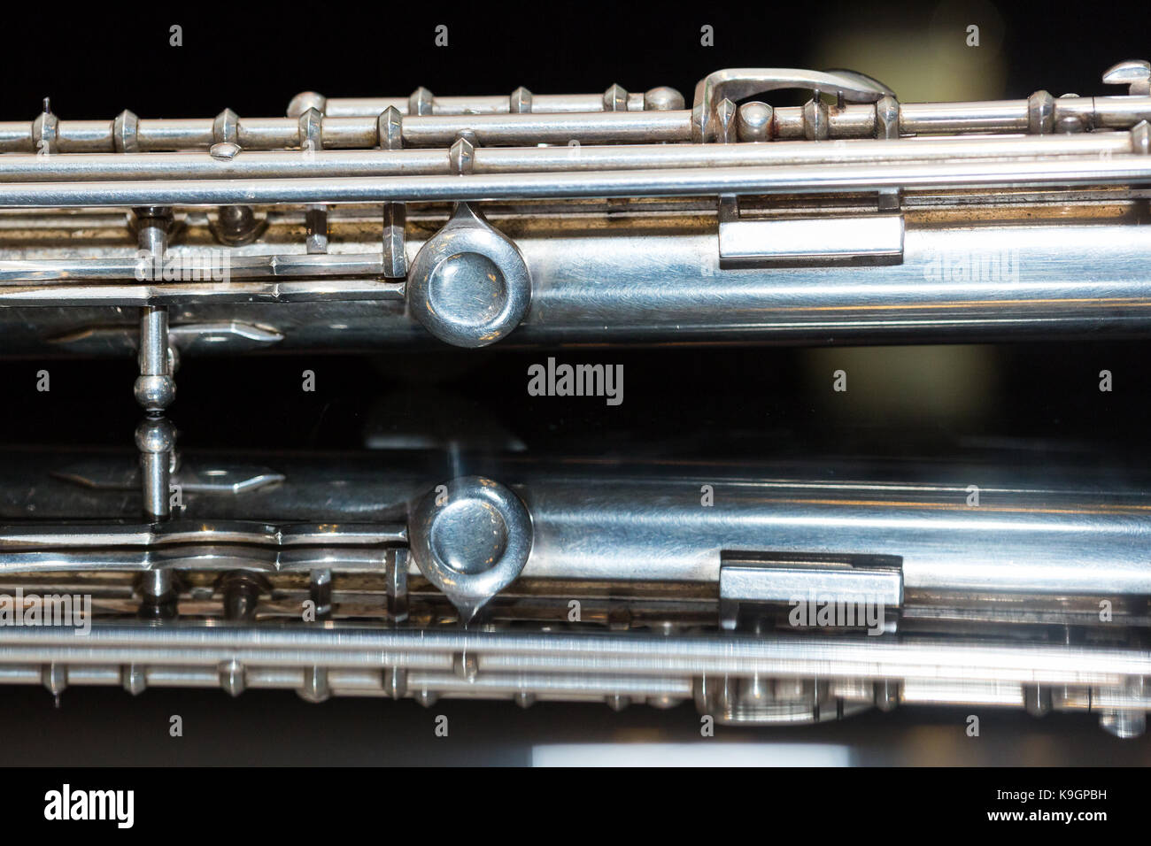 symphonic music concept - closeup on western concert flute body lies on ...
