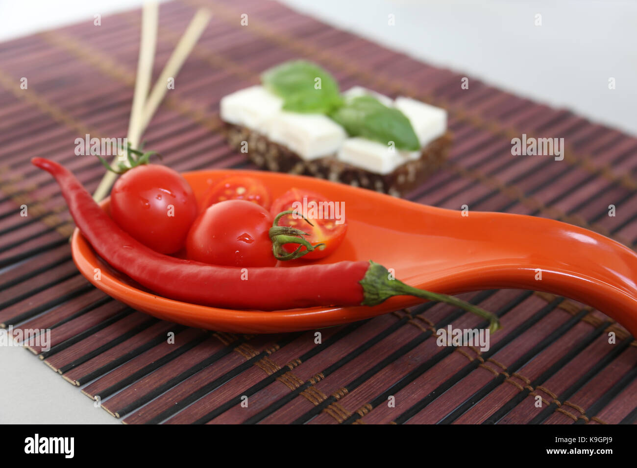 Fresh cherry tomatoes and chees on table Stock Photo - Alamy