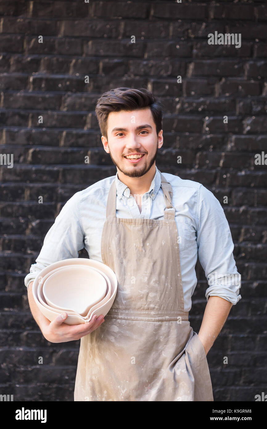 potter, utensils, ceramics art concept - smiling male ceramist with ...