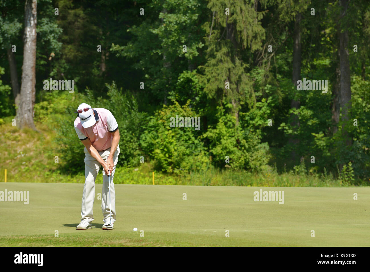 Tseleevo, Moscow region, Russia - July 24, 2014: Unidentified golfer on ...