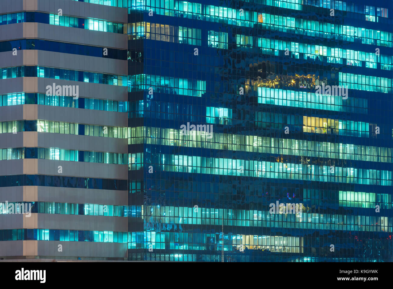 windows of office buildings illuminated at night for background Stock ...