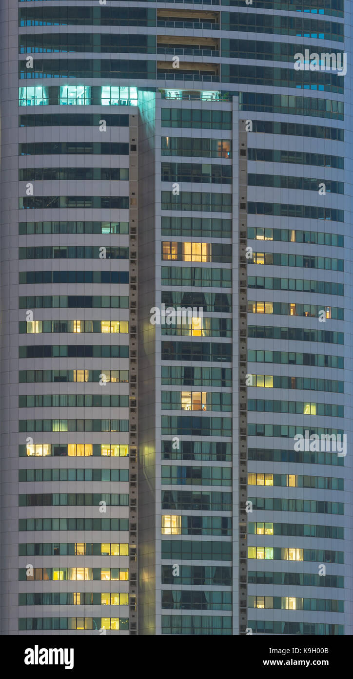 windows of office buildings illuminated at night for background Stock ...