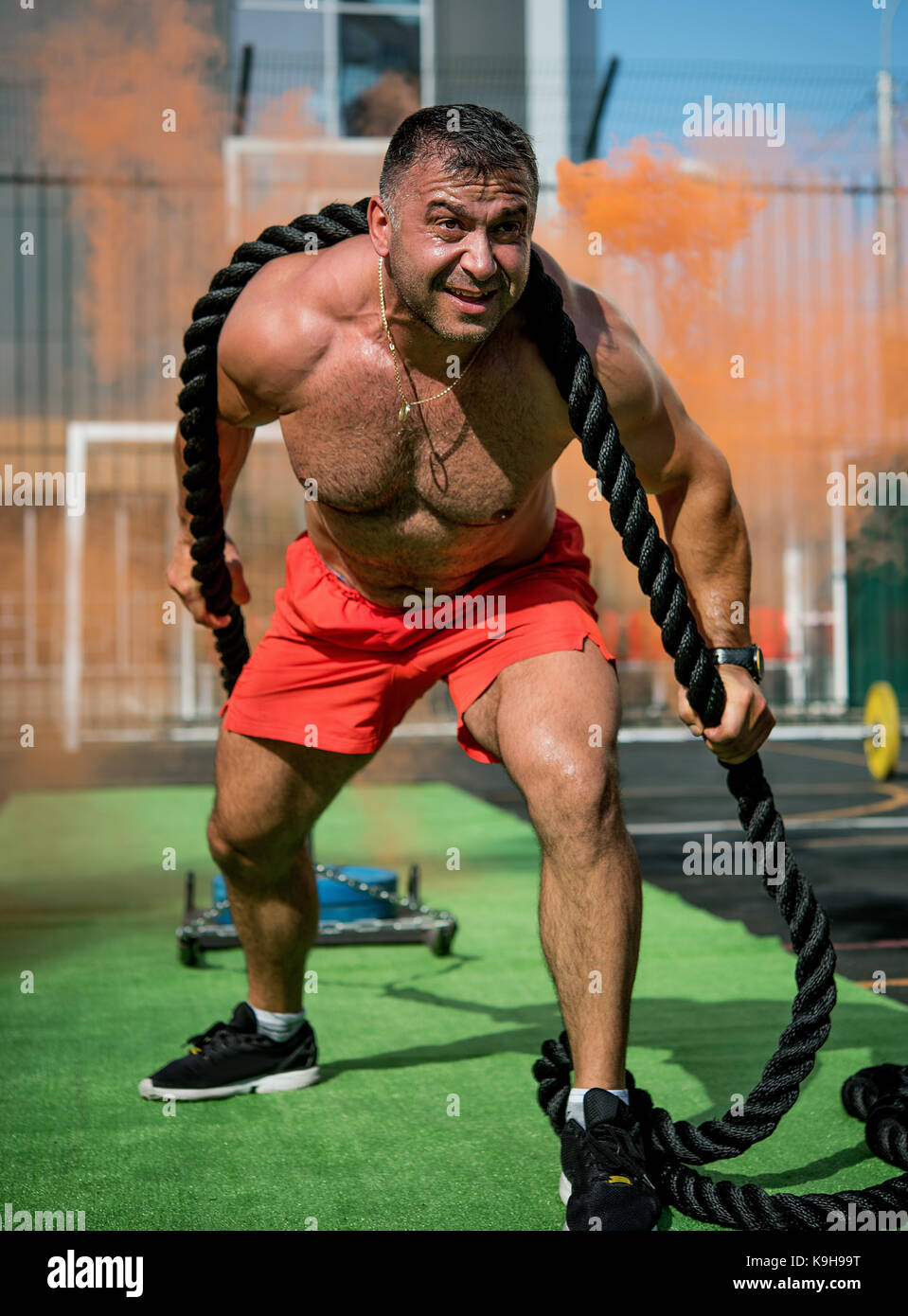 athlete pulls the rope Stock Photo - Alamy