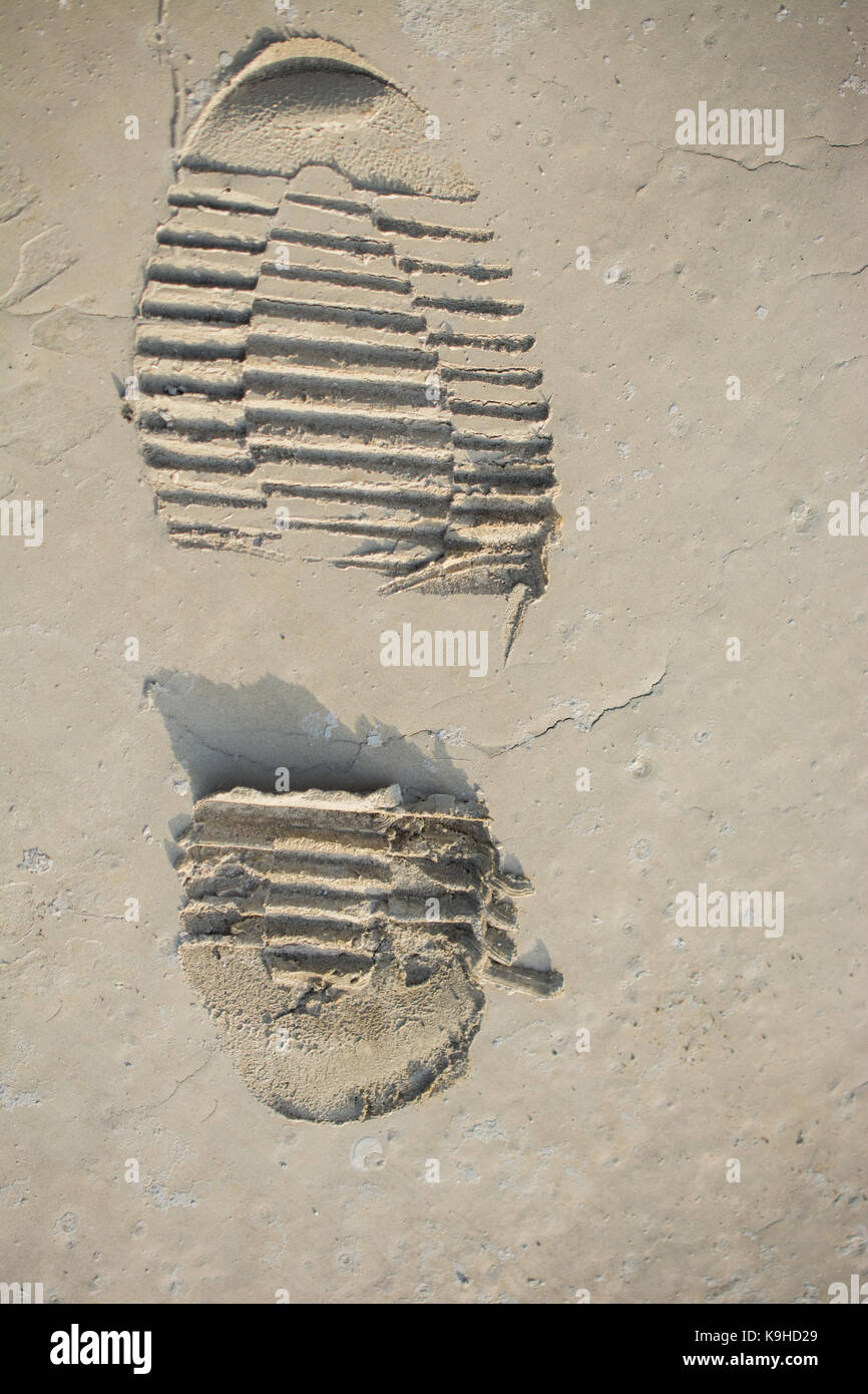 Footstep pattern seen on a concrete background Stock Photo - Alamy