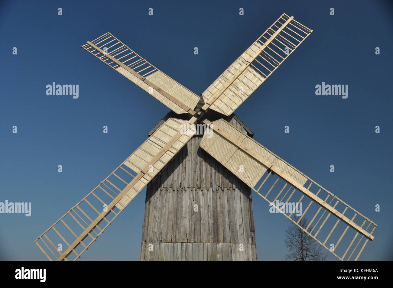 Wooden windmill. Monument. Antique mill powered by the wind Stock Photo ...