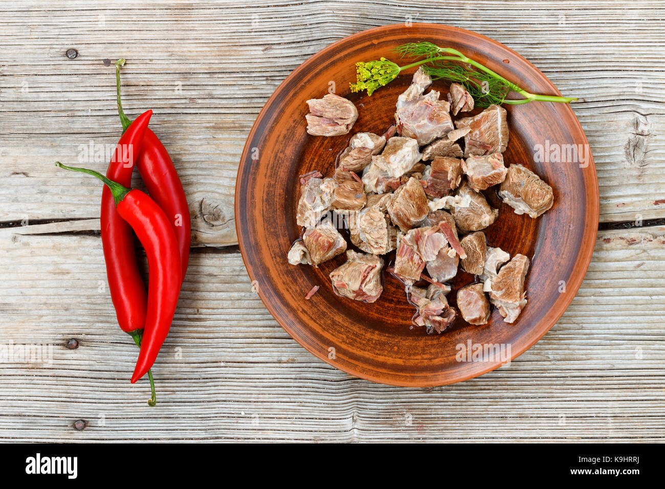Boiled meat closeup with red Hot chilli pepper wooden background Stock ...