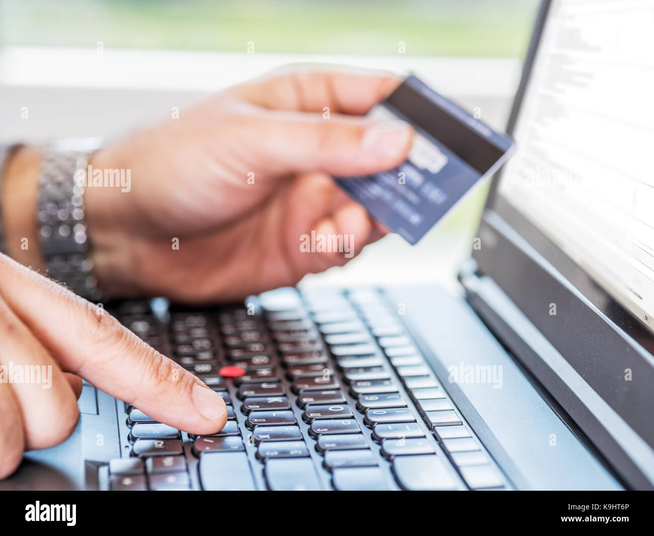 Online shopping using credit card and laptop Stock Photo - Alamy